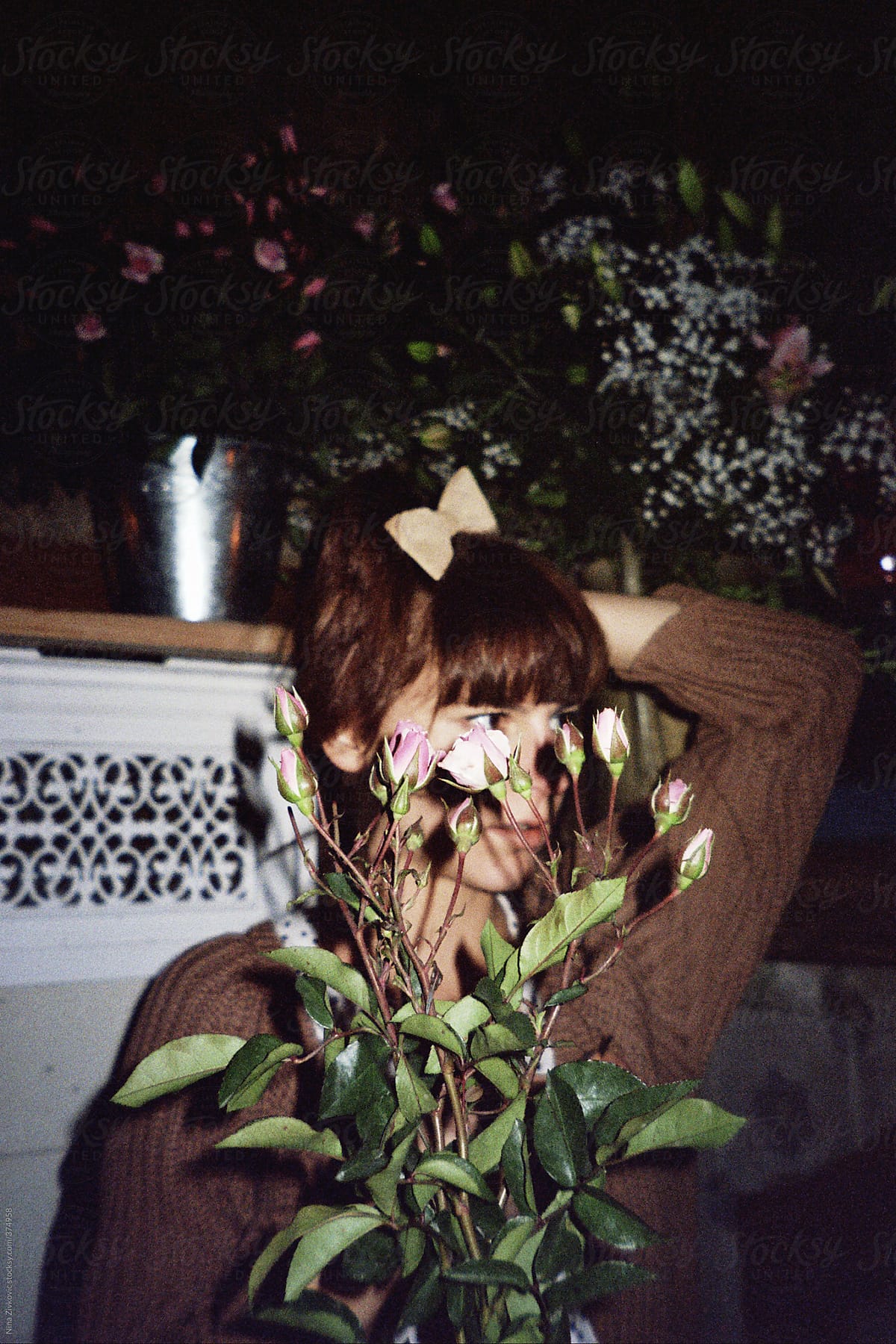 "Hiding Behind Flowers." by Stocksy Contributor "Nina Zivkovic" - Stocksy