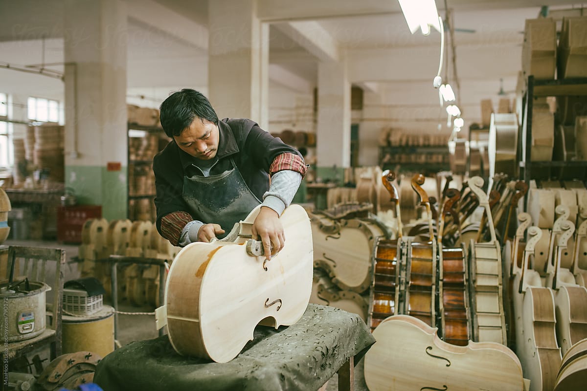 "Violin Maker At Work" by Stocksy Contributor "MaaHoo" - Stocksy