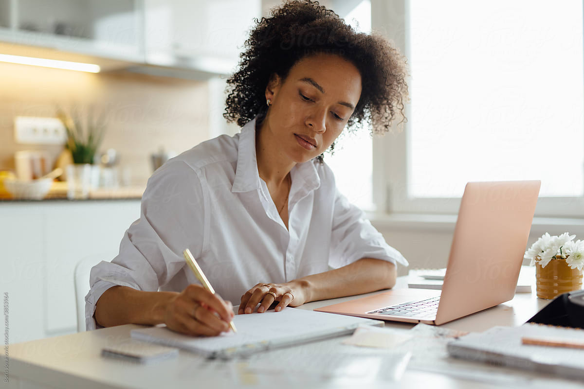 "Portrait Of A Focused Woman Writing" by Stocksy Contributor "Boris ...