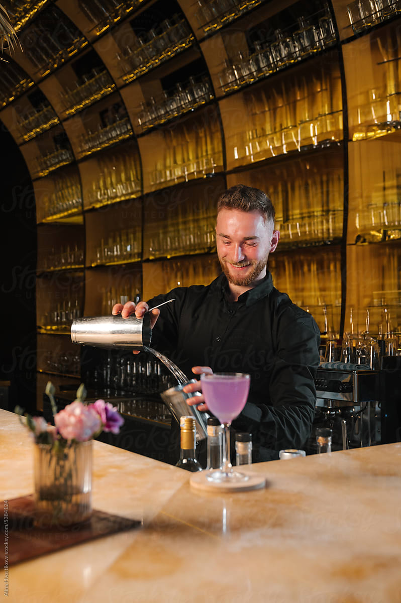 "Smiling Male Barkeeper Making Cocktail" by Stocksy Contributor "Alina ...