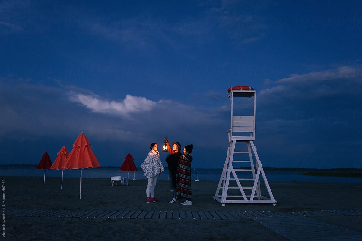 "Girls In Plaids On Night Beach" by Stocksy Contributor "Alexandr ...