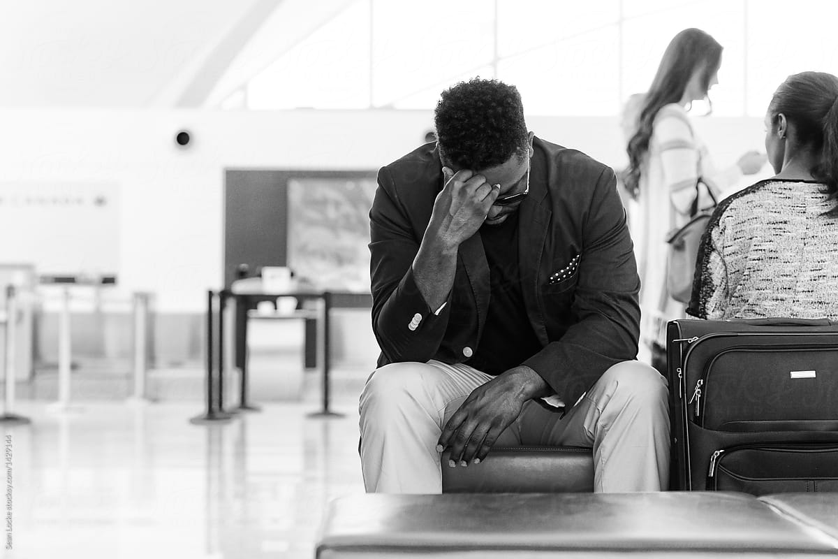 "Airport: Tired Man Sits On Bench In Waiting Area" by Stocksy ...
