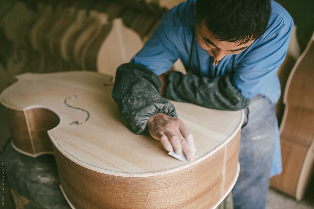 "Violoncello Maker At Work" by Stocksy Contributor "MaaHoo" - Stocksy