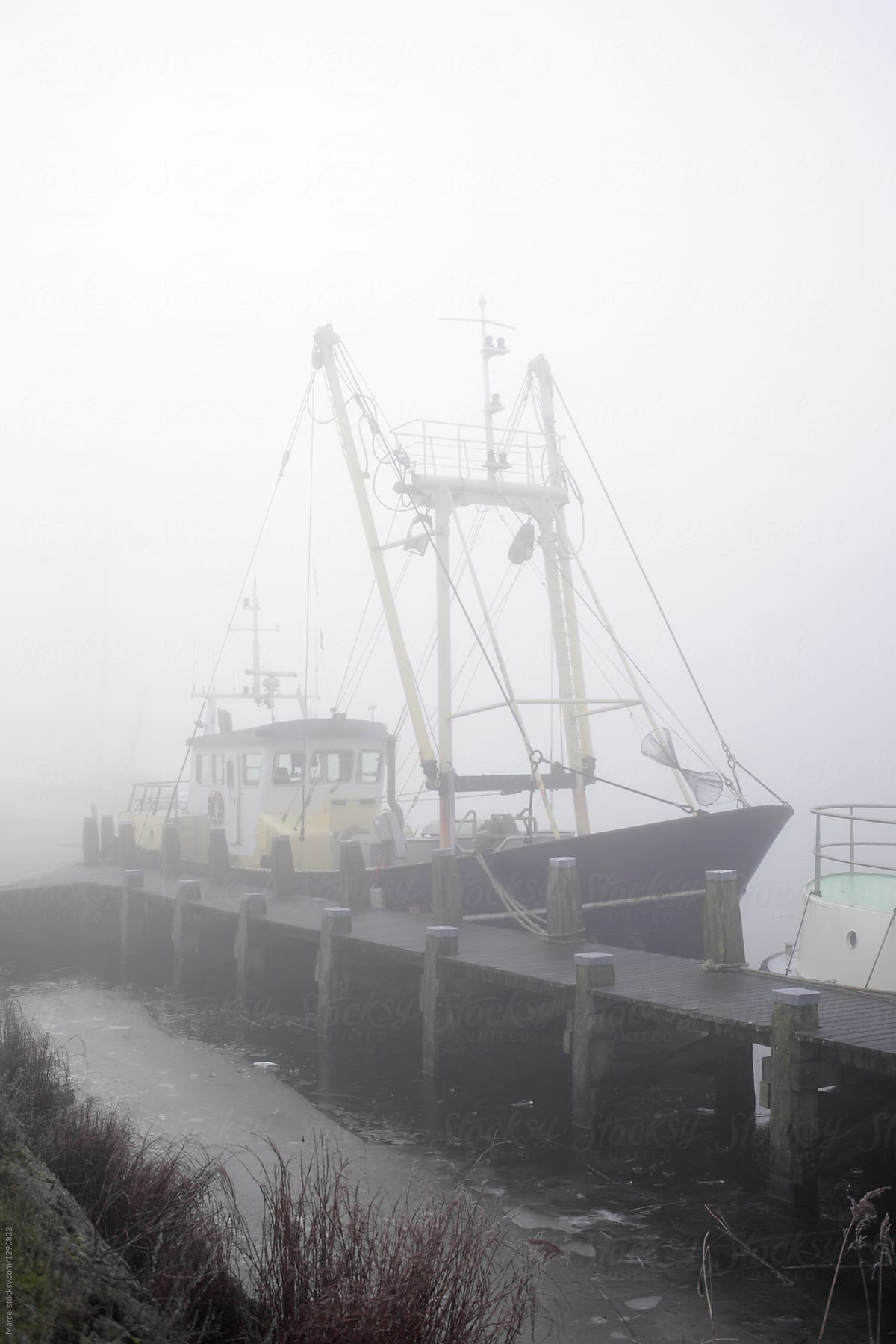 "Fishing Boat In The Fog" by Stocksy Contributor "Marcel" - Stocksy