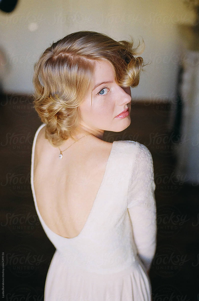 "Portrait Of Young Woman Staring Over Her Shoulder" by Stocksy ...