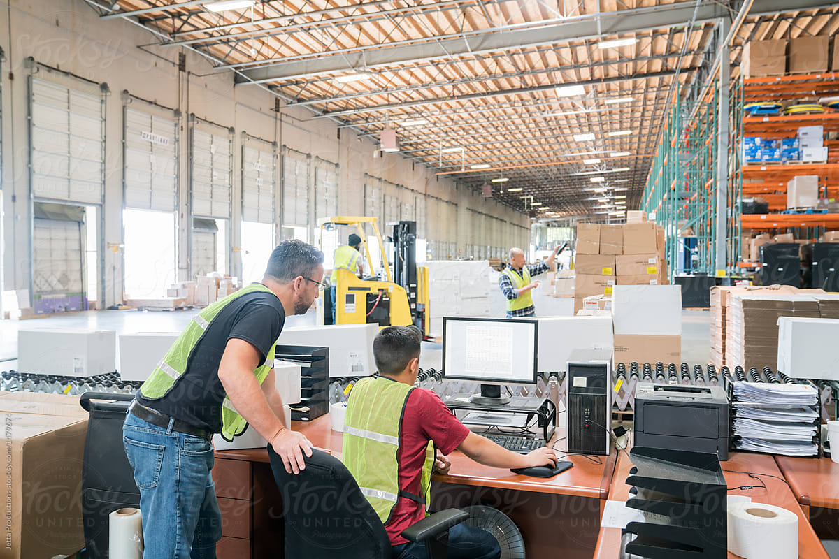 "Warehouse Workers At Computer." by Stocksy Contributor "Walter And Deb ...
