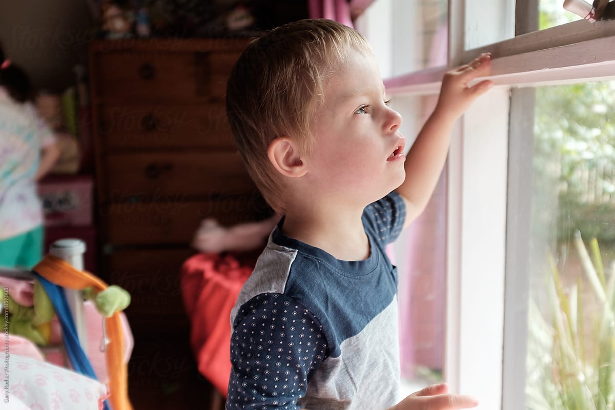 "Little Boy At Bedroom Window" by Stocksy Contributor "Gary Radler ...
