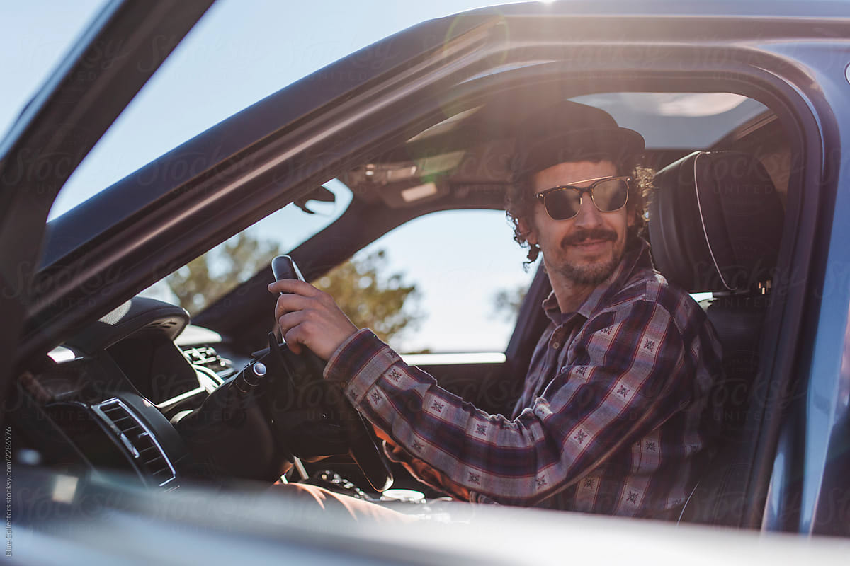 "Adventurer Man Driving" by Stocksy Contributor "Jordi Rulló" - Stocksy