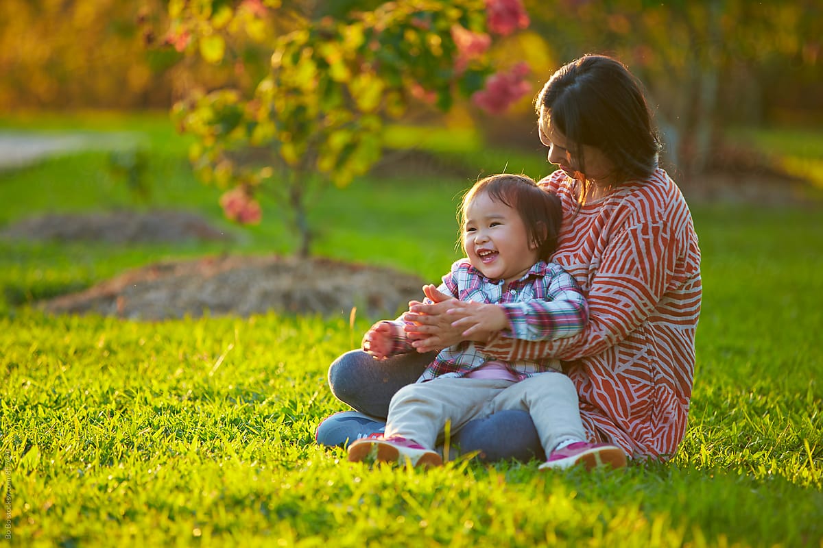 "Happy Little Girl With Her Mother Outdoor In The Sunshine Park" by ...
