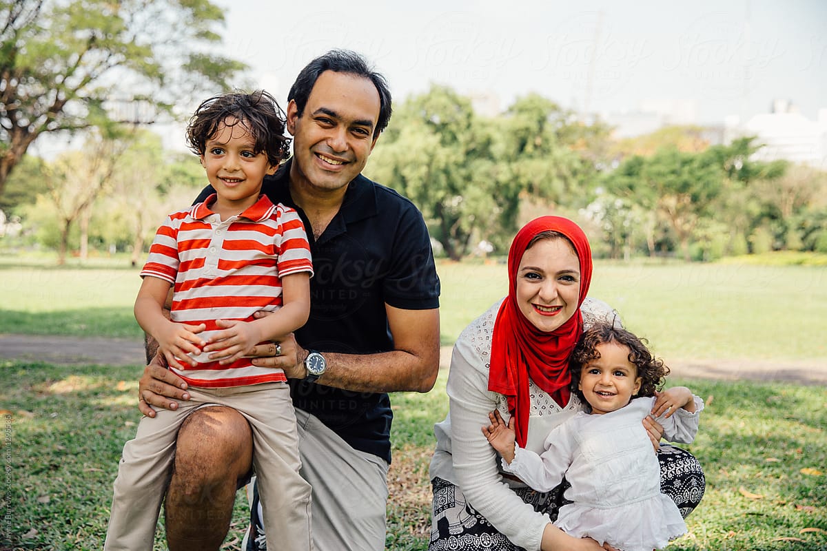 "Family Of Four Posing For A Portrait" by Stocksy Contributor "Jayme ...