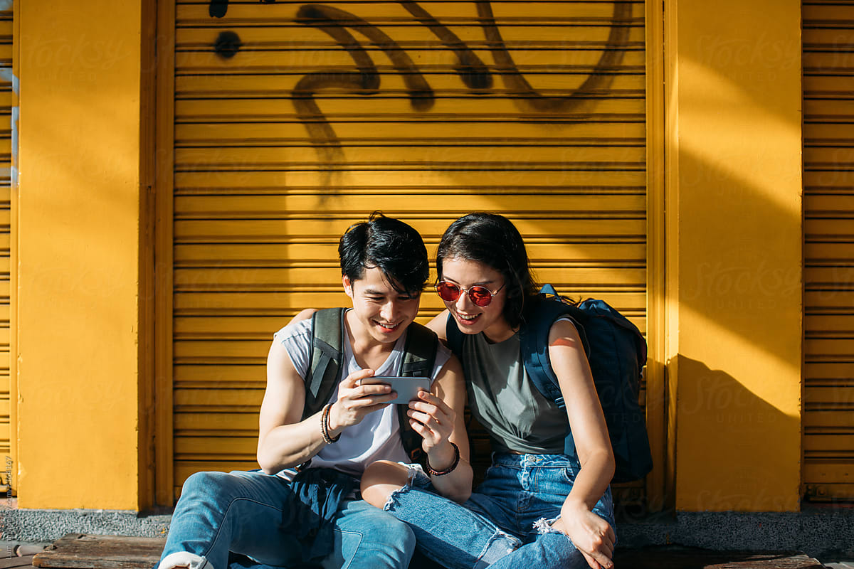 "Young Asian Woman Using Cell Phone" by Stocksy Contributor "Lumina ...