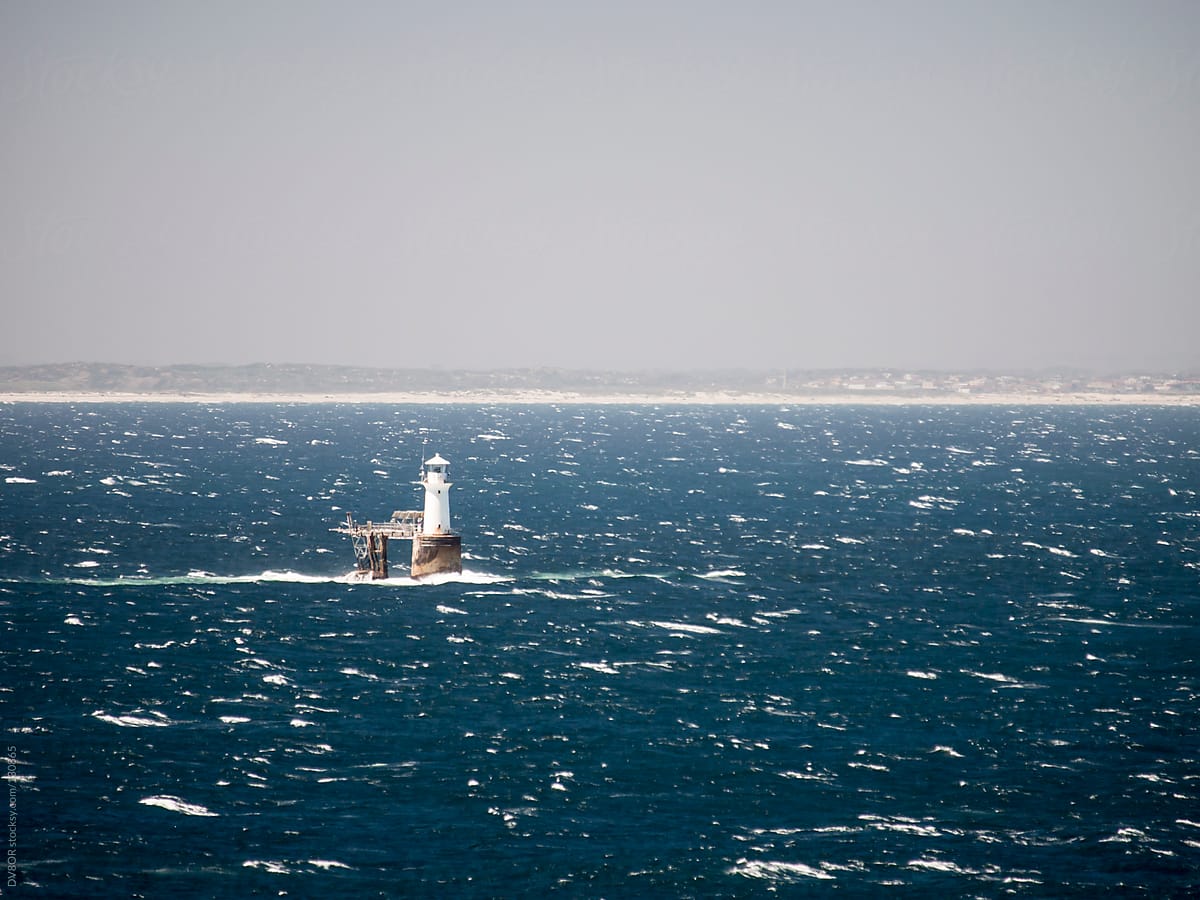 "Lighthouse On Windy Seas With Waves" by Stocksy Contributor "DV8OR ...