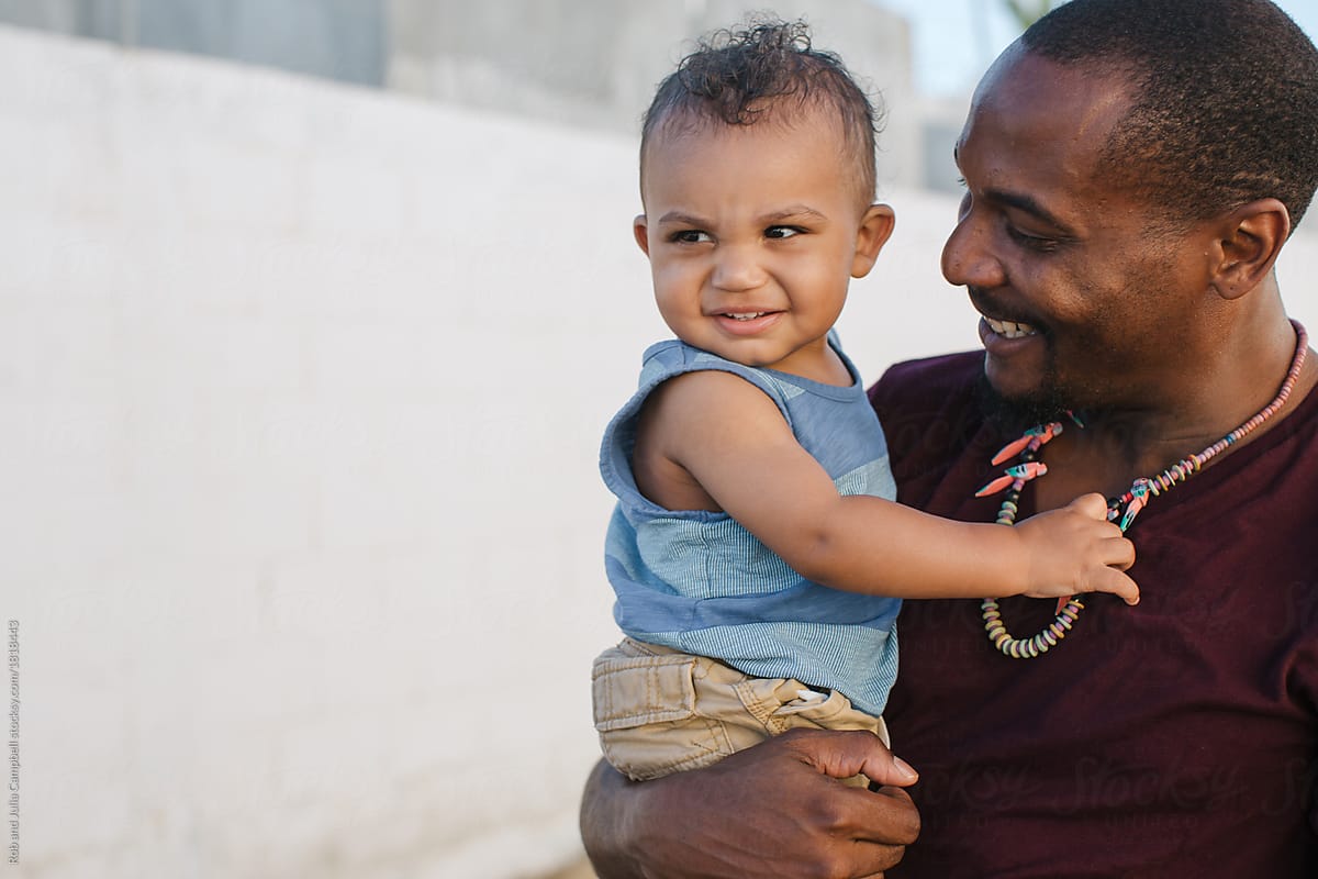 "Young Dad Enjoying Son Outside On Sunny Day" by Stocksy Contributor ...