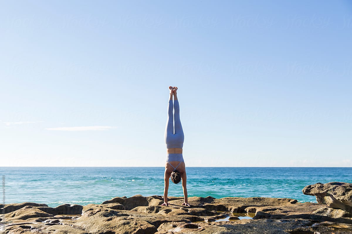 "A Female Yogi Performing Handstands At The Beach" by Stocksy ...