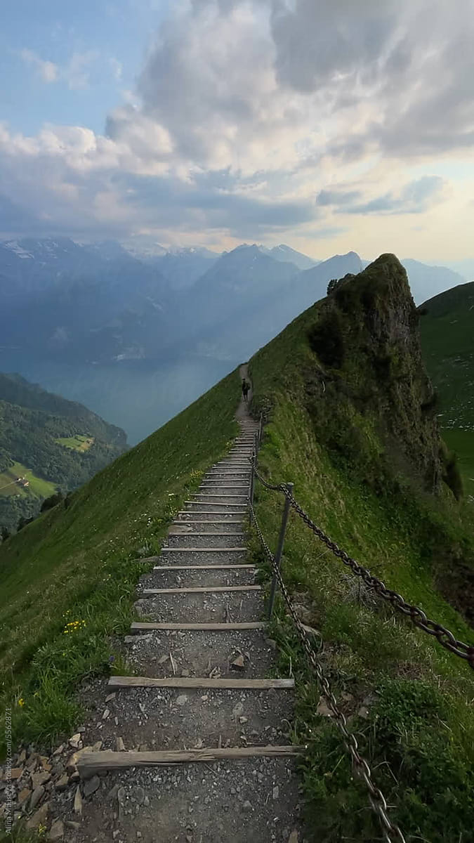 "Traveler Hiking On Scenic Path In Swiss Alps" by Stocksy Contributor ...
