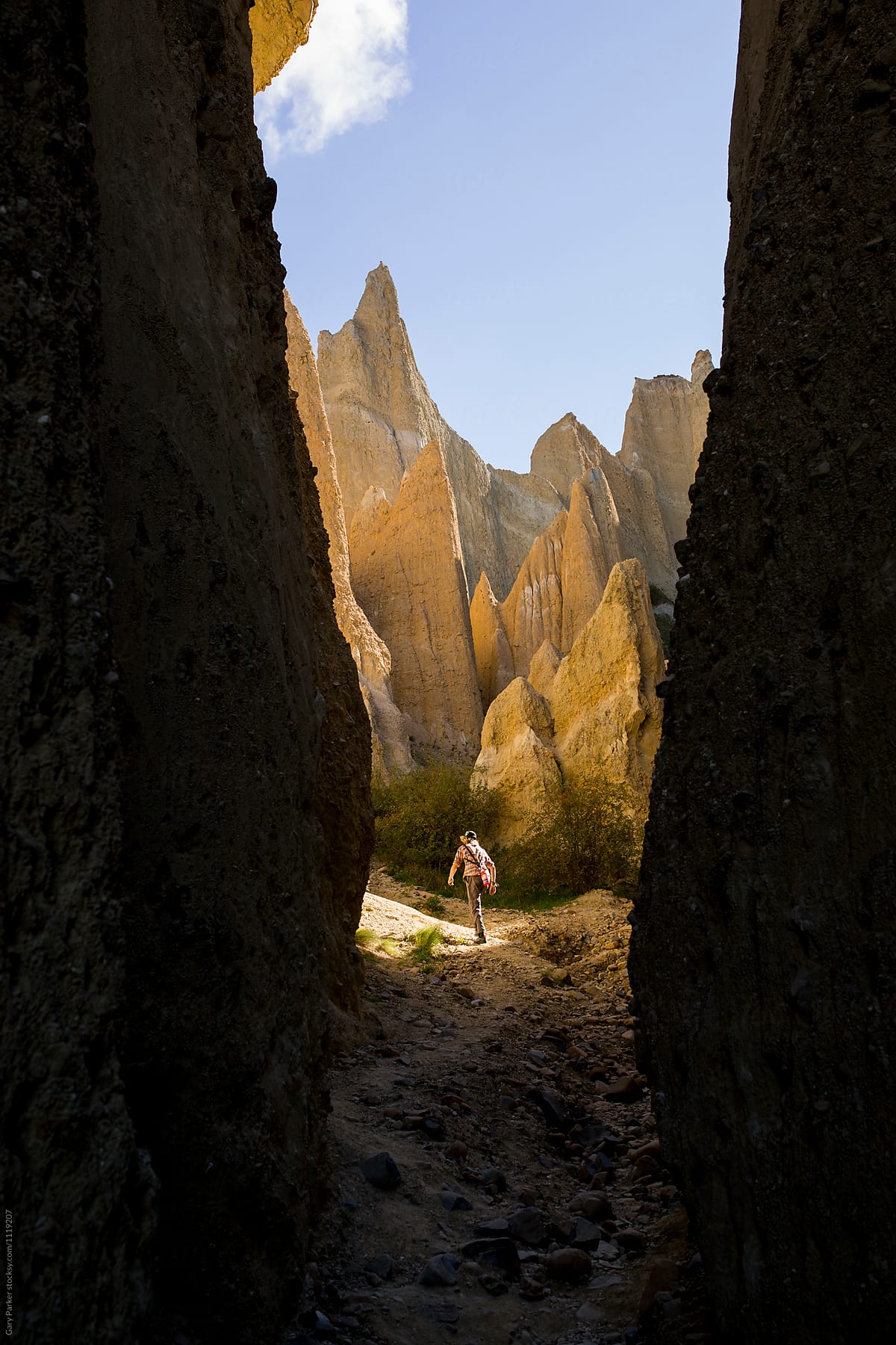 "Man Hiking In A Clay Canyon" by Stocksy Contributor "Gary Parker ...