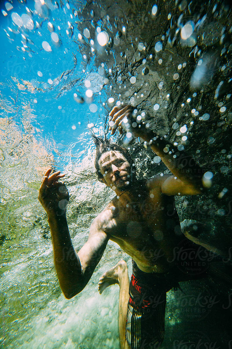 "Swimming In Nature In A River" by Stocksy Contributor "Juno" - Stocksy
