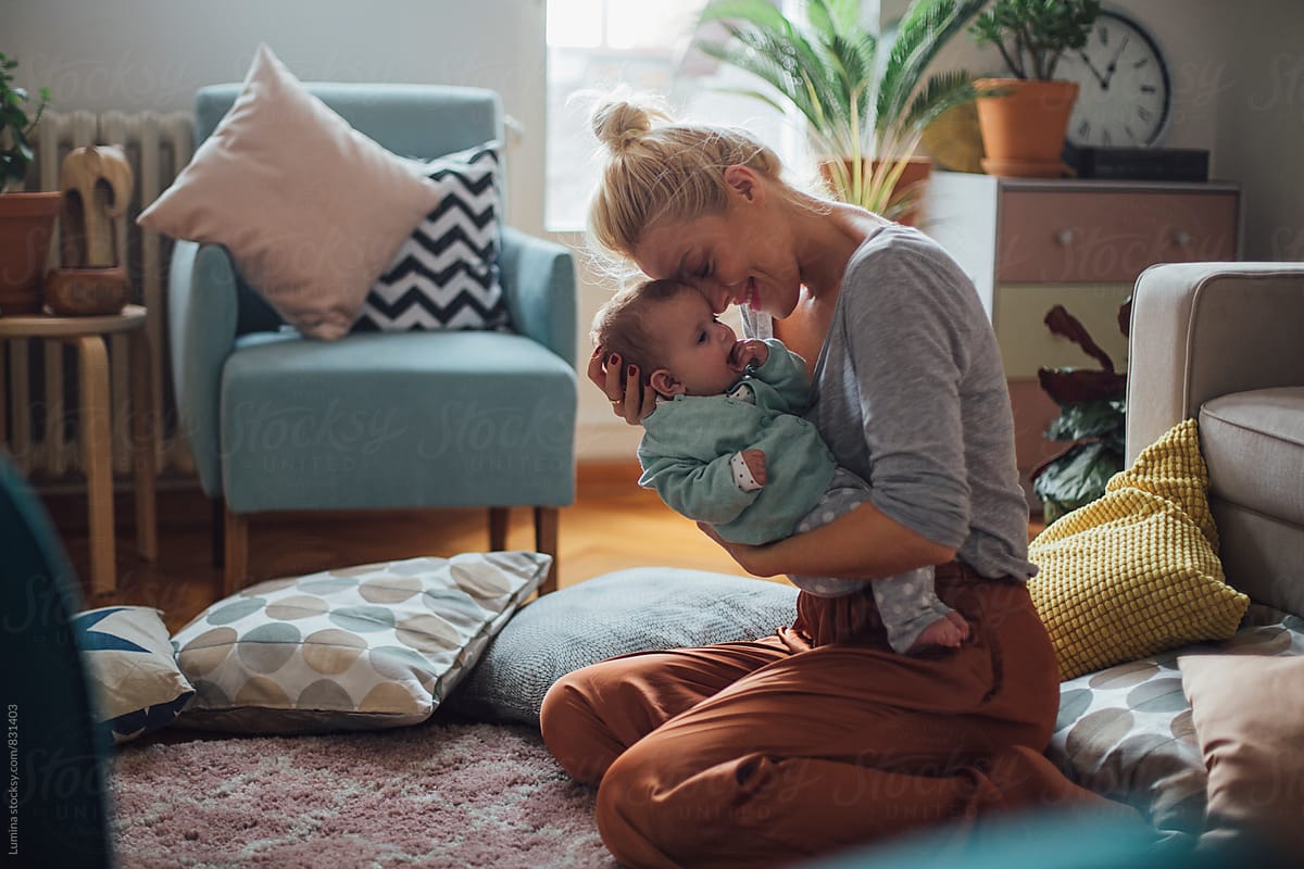 "Mother Caressing Baby Girl" by Stocksy Contributor "Lumina" - Stocksy