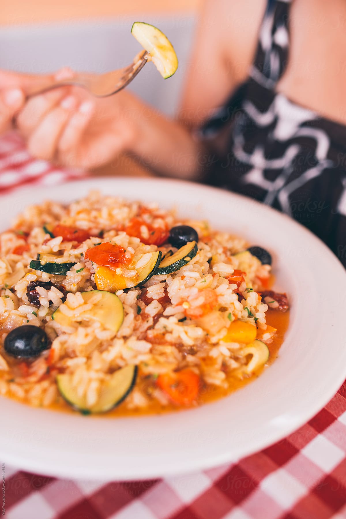 "Woman Eating A Risotto For Lunch" by Stocksy Contributor "Maja ...
