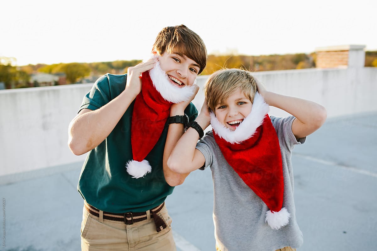 "Two Boys Wearing Santa Beards" by Stocksy Contributor "Erin Drago ...