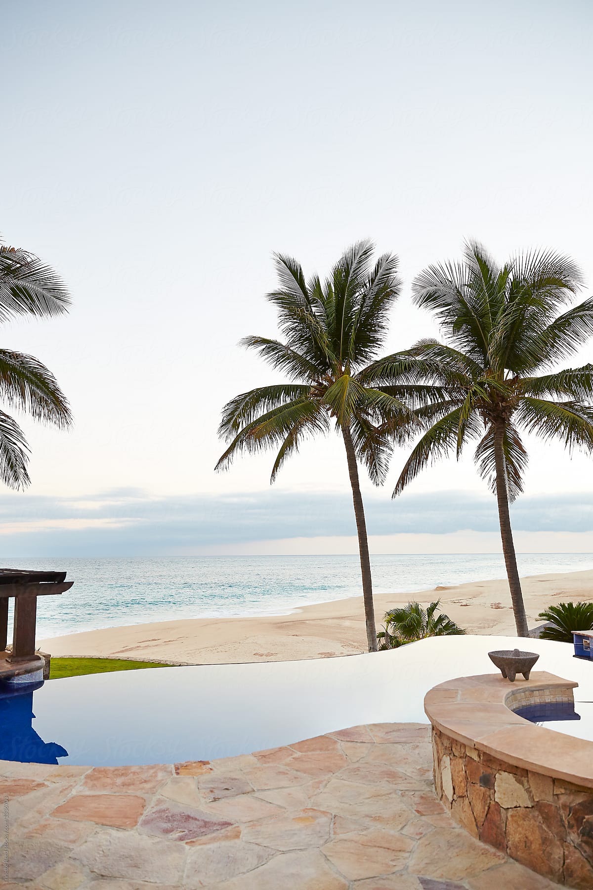 "Infinity Pool In An Idyllic Tropical Beach Setting" by Stocksy ...