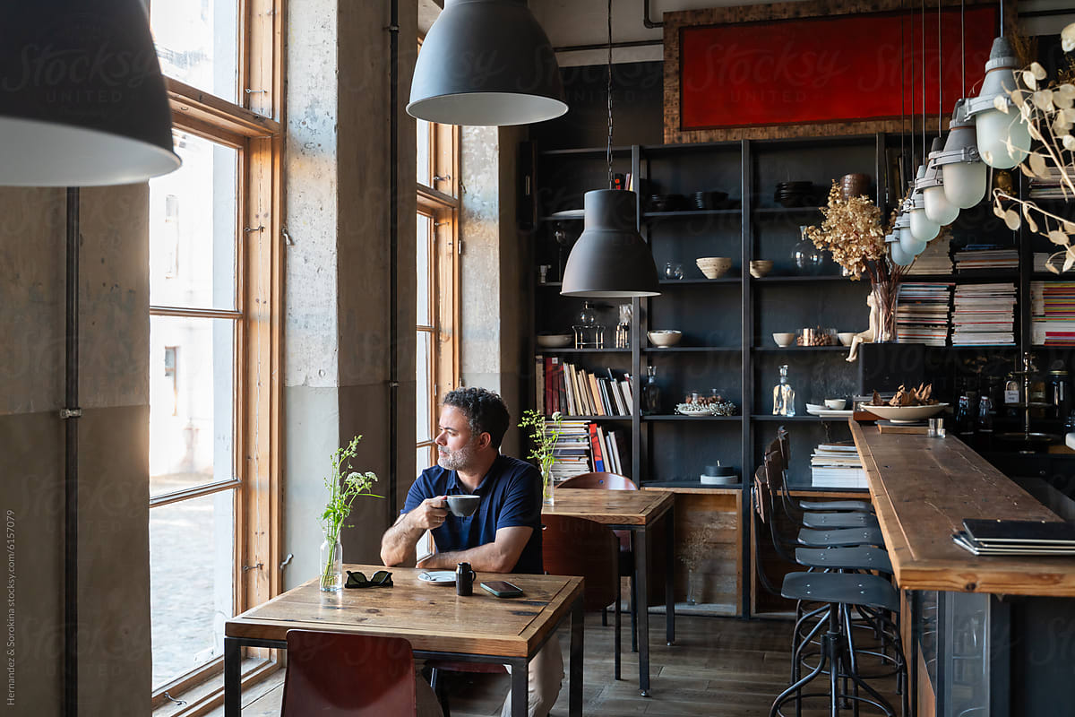 "Man Having A Coffee In Cafeteria" by Stocksy Contributor "Hernandez ...