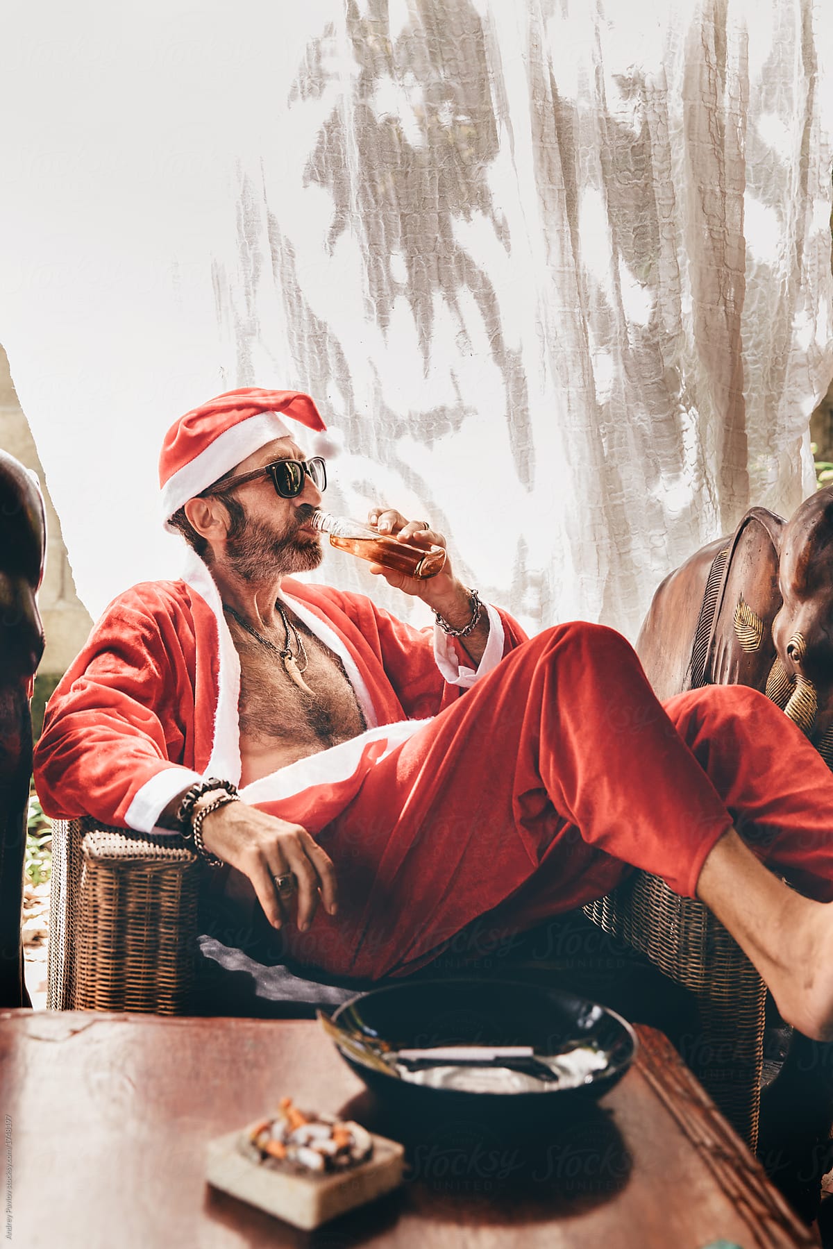 "Santa With Alcohol" by Stocksy Contributor "Andrey Pavlov" - Stocksy