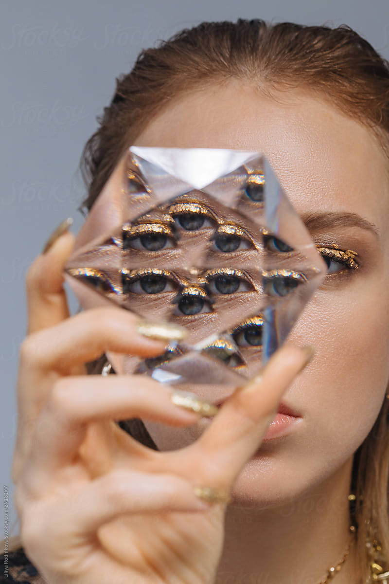 "Woman With Glitter Makeup Looking Through Glass Prism" by Stocksy ...