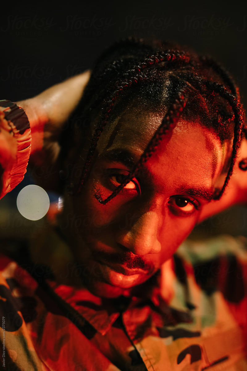 "Stylish Black Man At Night" by Stocksy Contributor "Javier Díez" - Stocksy
