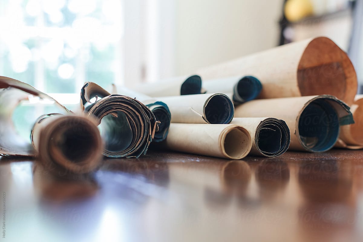 "Pile Of Antique Scrolls Sit On Wooden Desktop In Office" by Stocksy ...