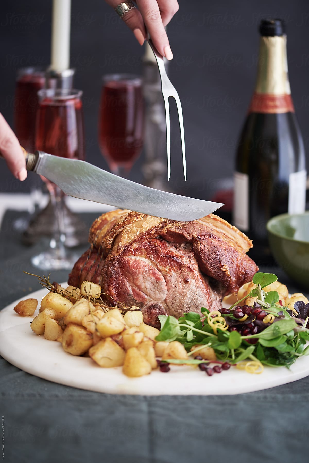 "Roast Pork On Dinner Table" by Stocksy Contributor "Darren Muir" - Stocksy