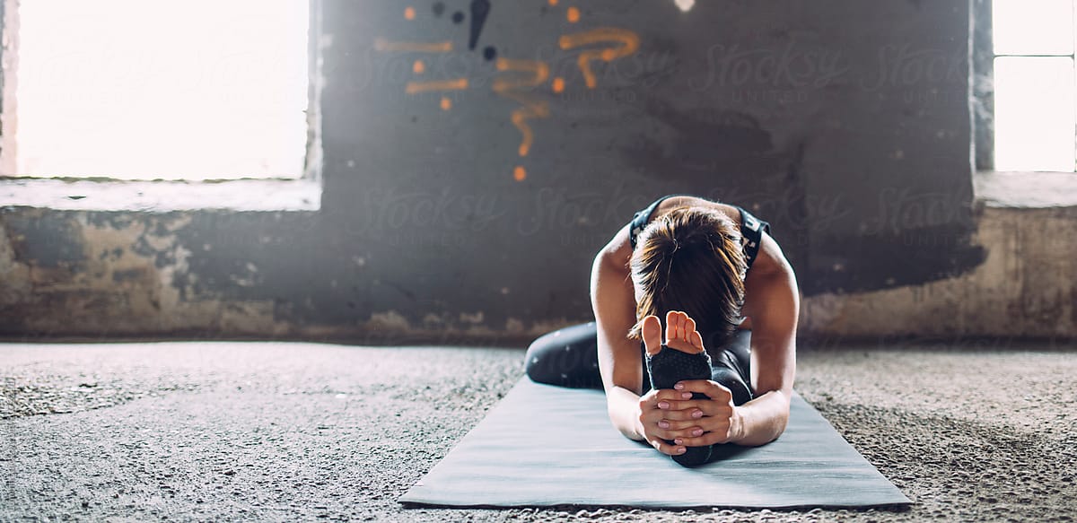 "Woman Doing Exercise On The Floor" by Stocksy Contributor "Lumina ...
