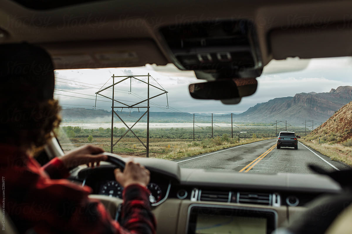 "Adventurer Man Driving" by Stocksy Contributor "Jordi Rulló" - Stocksy