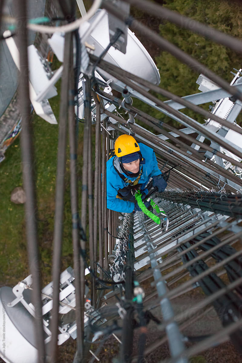 "Man Goes Up On Top Of A Communication Tower." by Stocksy Contributor ...