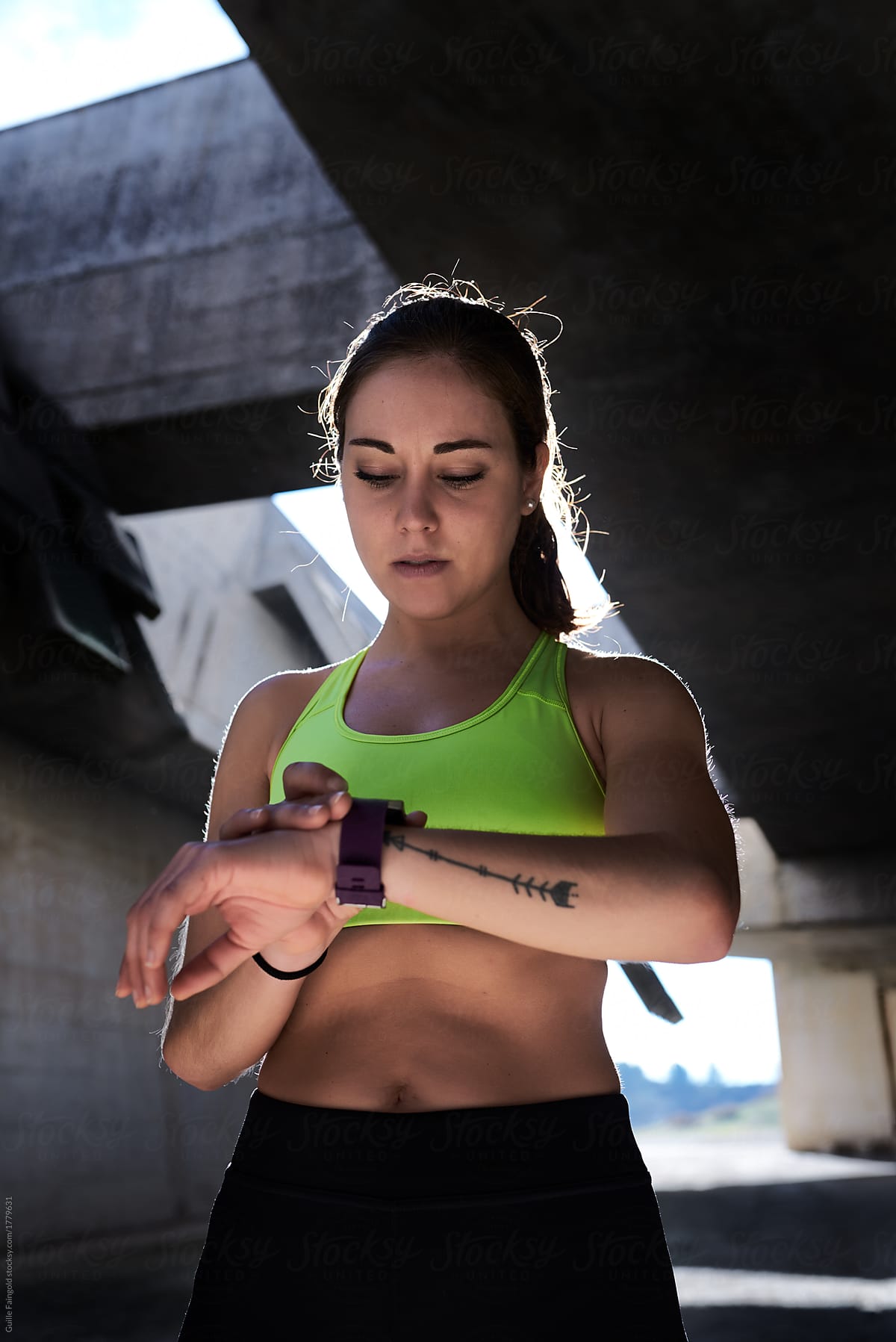 "Sportswoman Checking Time While Training Outside" by Stocksy ...