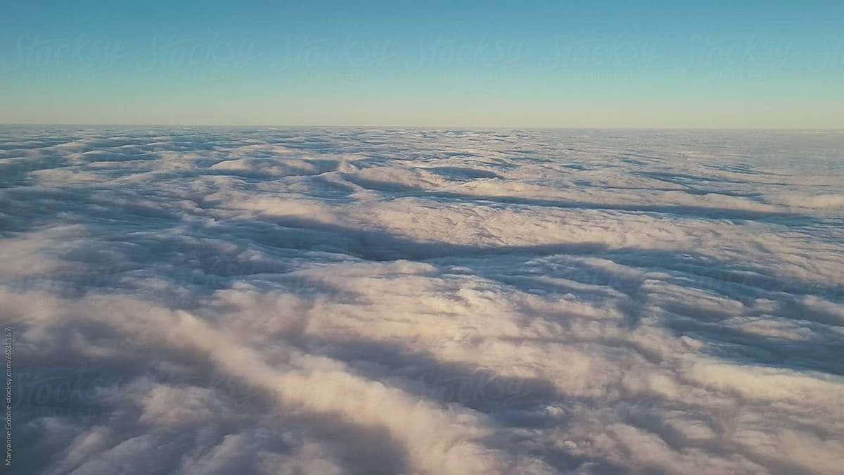 "Clouds While Flying In An Airplane" by Stocksy Contributor "Maryanne ...