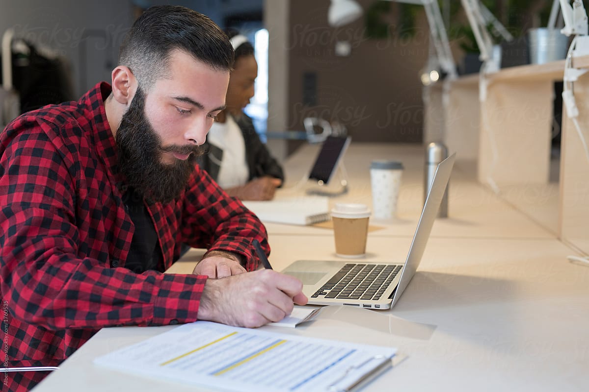 "Young Colleagues Concentrated On Work" by Stocksy Contributor "Studio ...