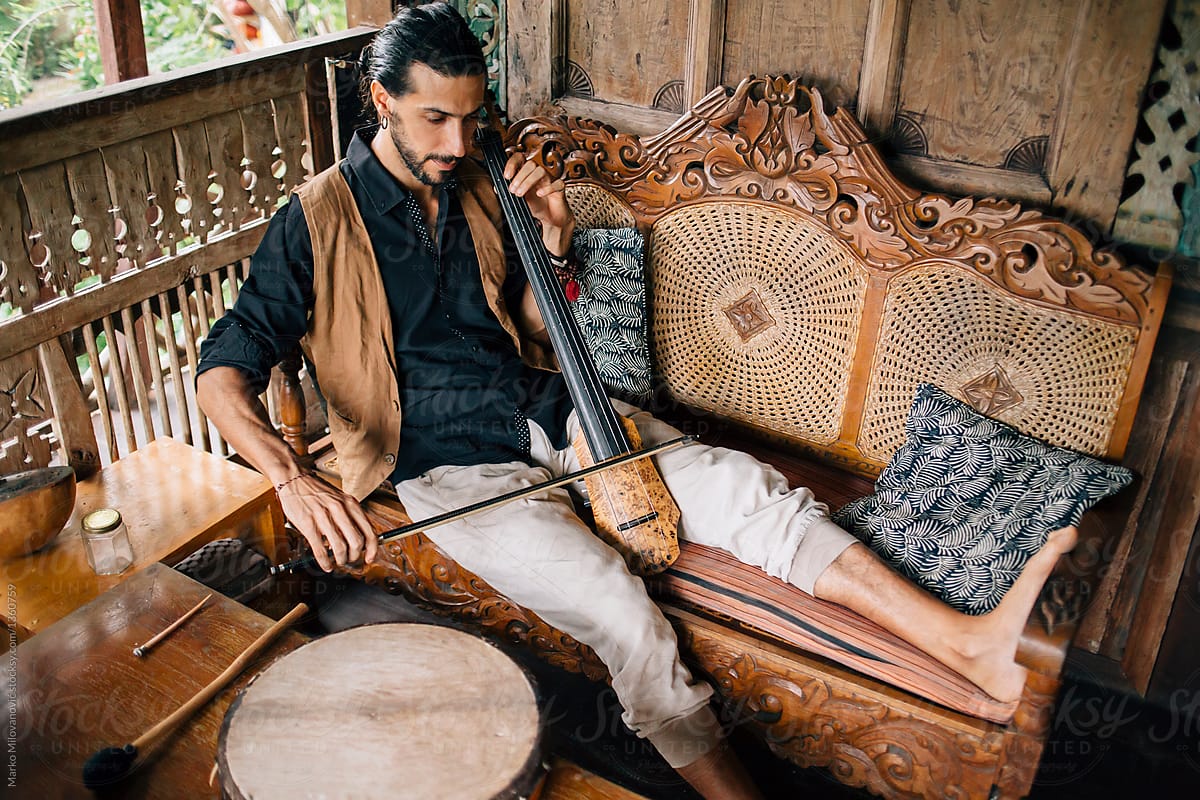 "Man Playing Cello On His Wooden Terrace" by Stocksy Contributor "Marko ...