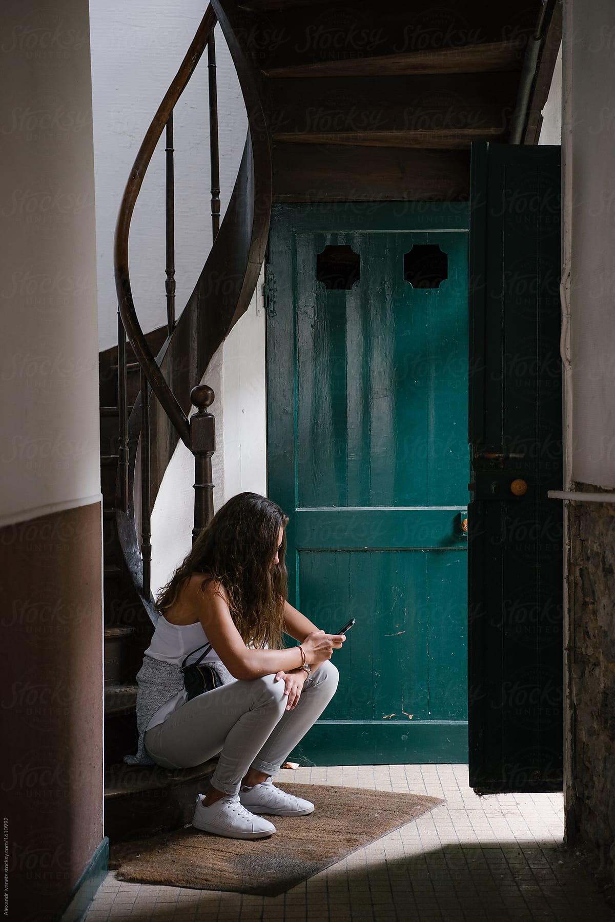 "Woman With Phone On Stairs In Home" by Stocksy Contributor "Alexandr ...
