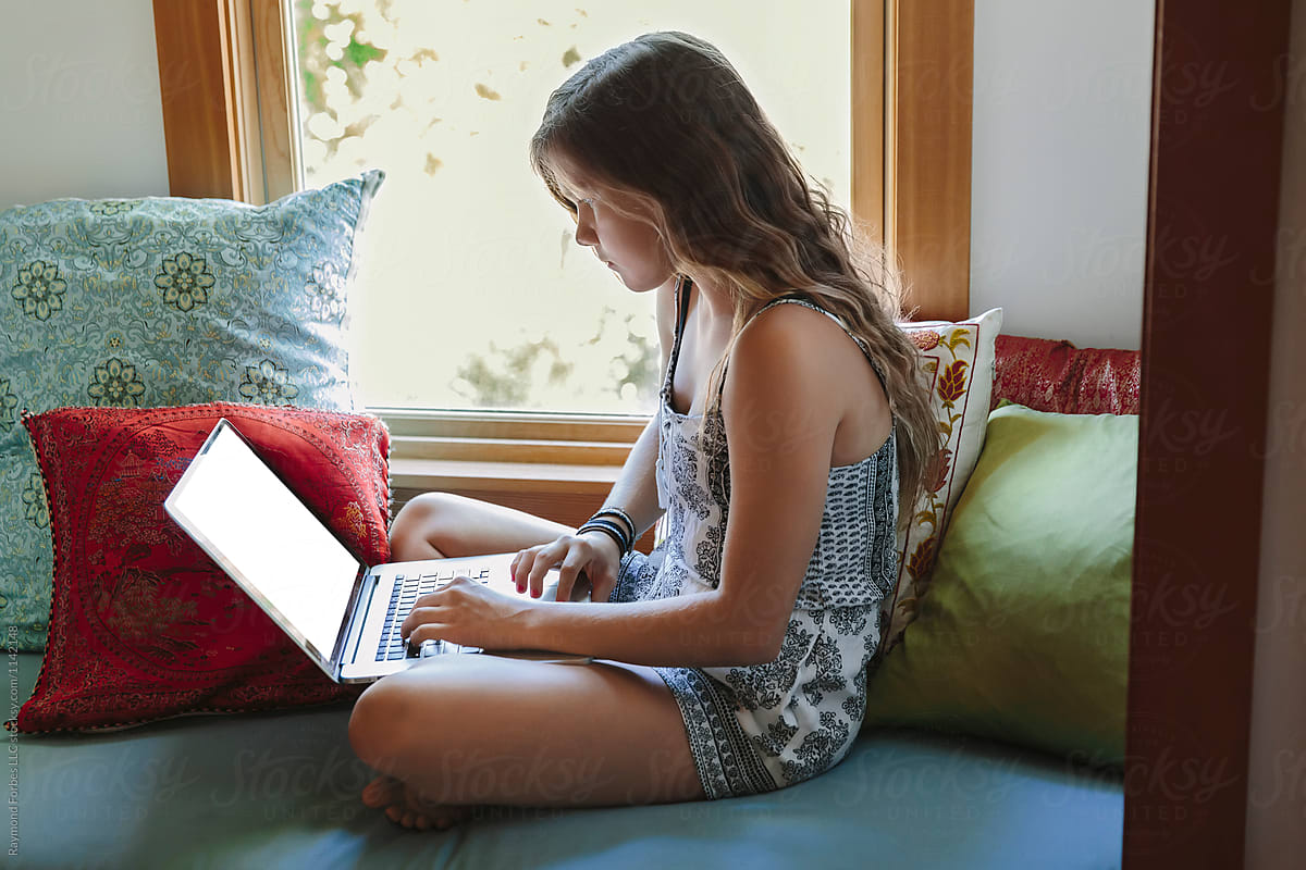 "Teen Working On Laptop Computer" by Stocksy Contributor "Raymond ...