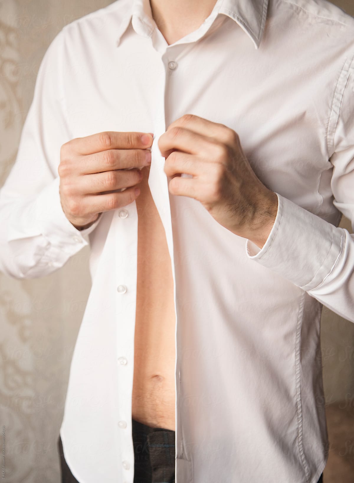 "Man's Torso With Hands Buttoning The Shirt" by Stocksy Contributor ...