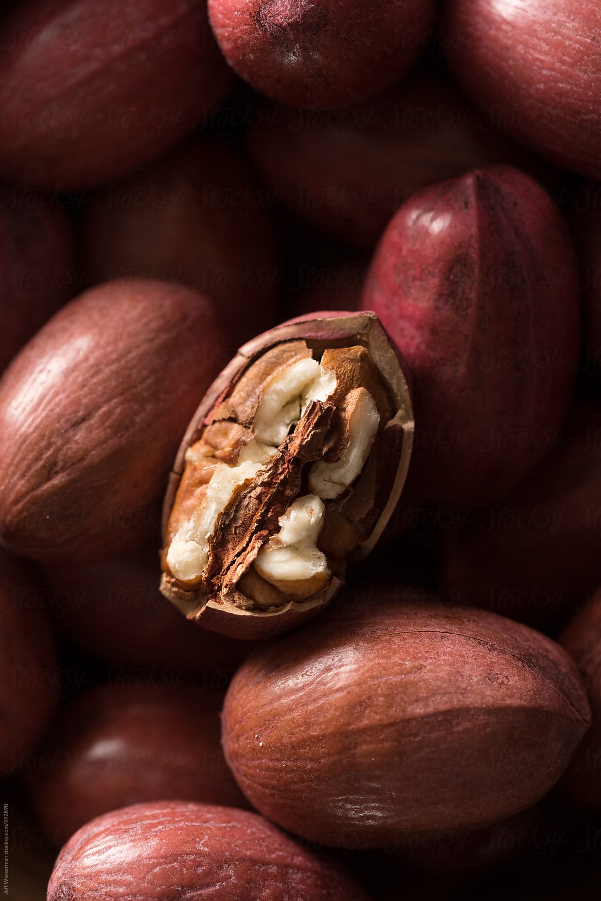 "Raw Pecan In Closeup" by Stocksy Contributor "Jeff Wasserman" - Stocksy