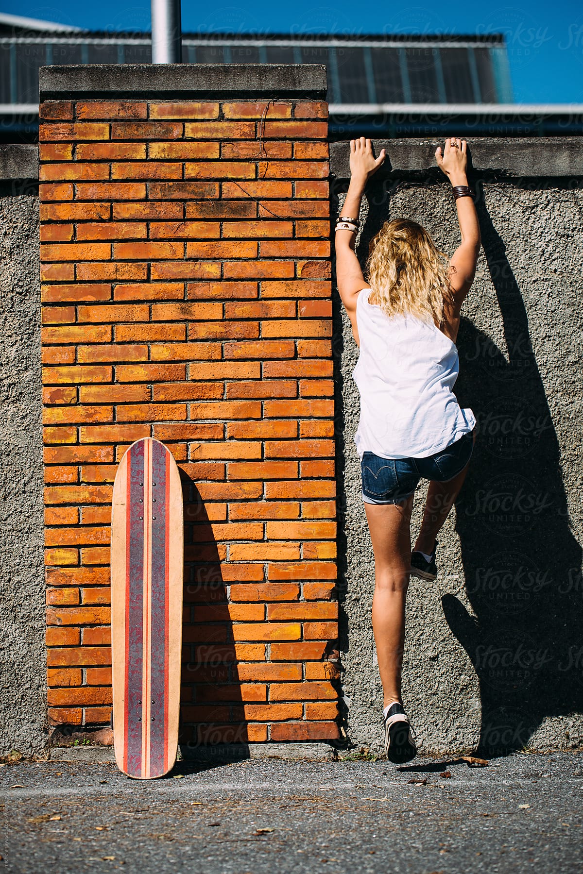 "Girl Climbing On A Wall" by Stocksy Contributor "Michela Ravasio ...