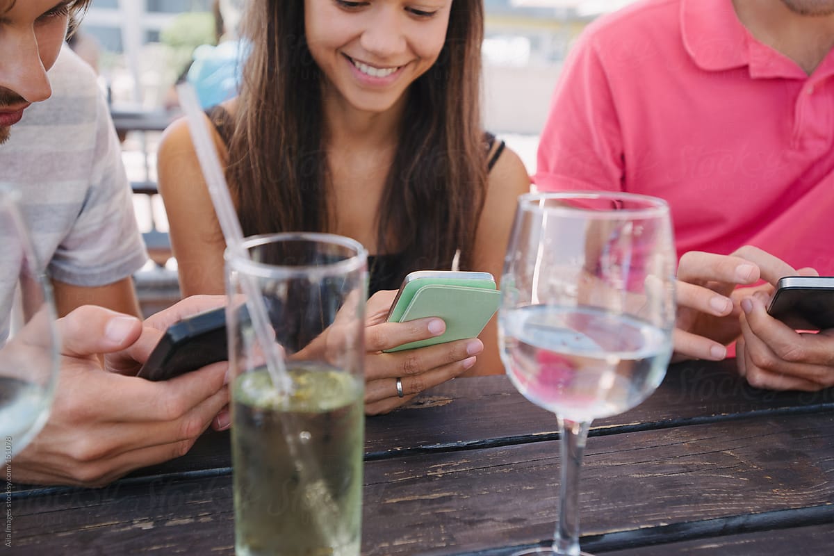 "Three Friends Sharing On Their Mobile Devices" by Stocksy Contributor ...