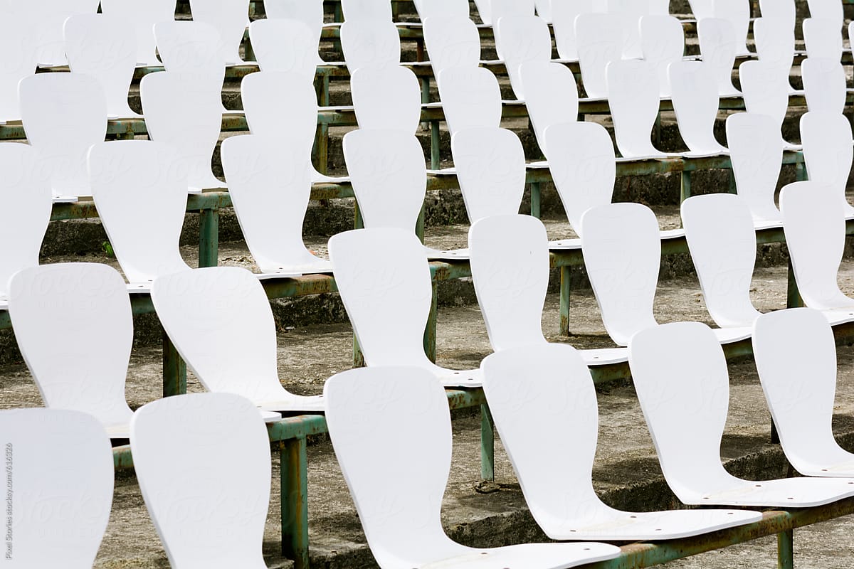 "Empty White Seats" by Stocksy Contributor "Sibila and Pavel" - Stocksy