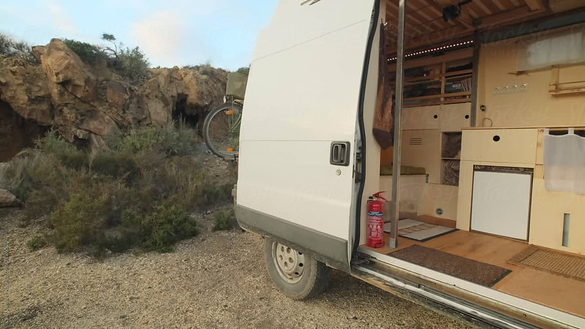 "Man Goes To The Back Of His Van To Unlock A Bicycle" by Stocksy ...