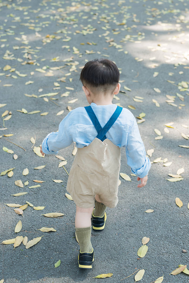 "Back View Of Little Boy Running At Park" by Stocksy Contributor "Marc ...