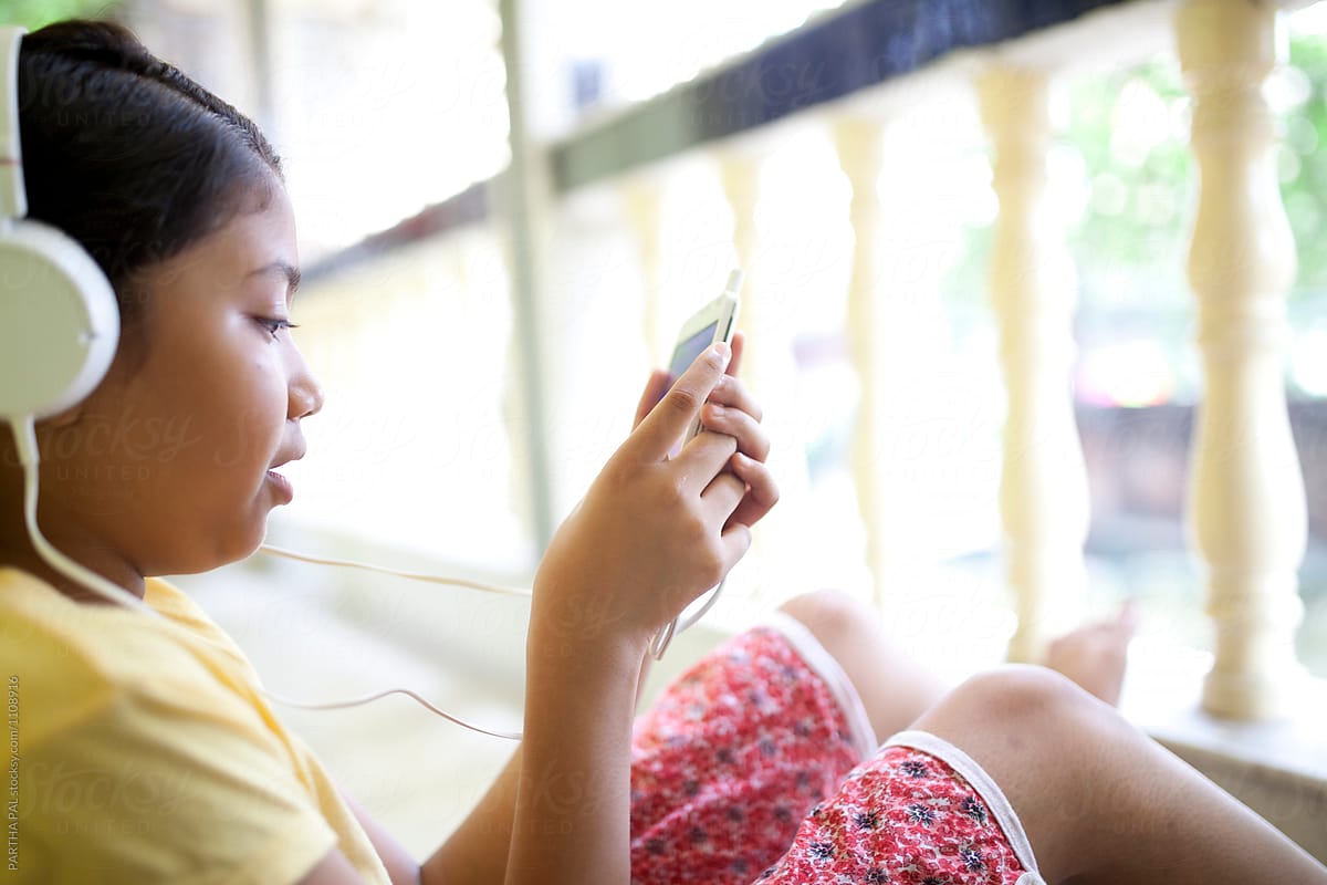 "Teenage Girl Browsing And Texting In Smartphone" by Stocksy ...
