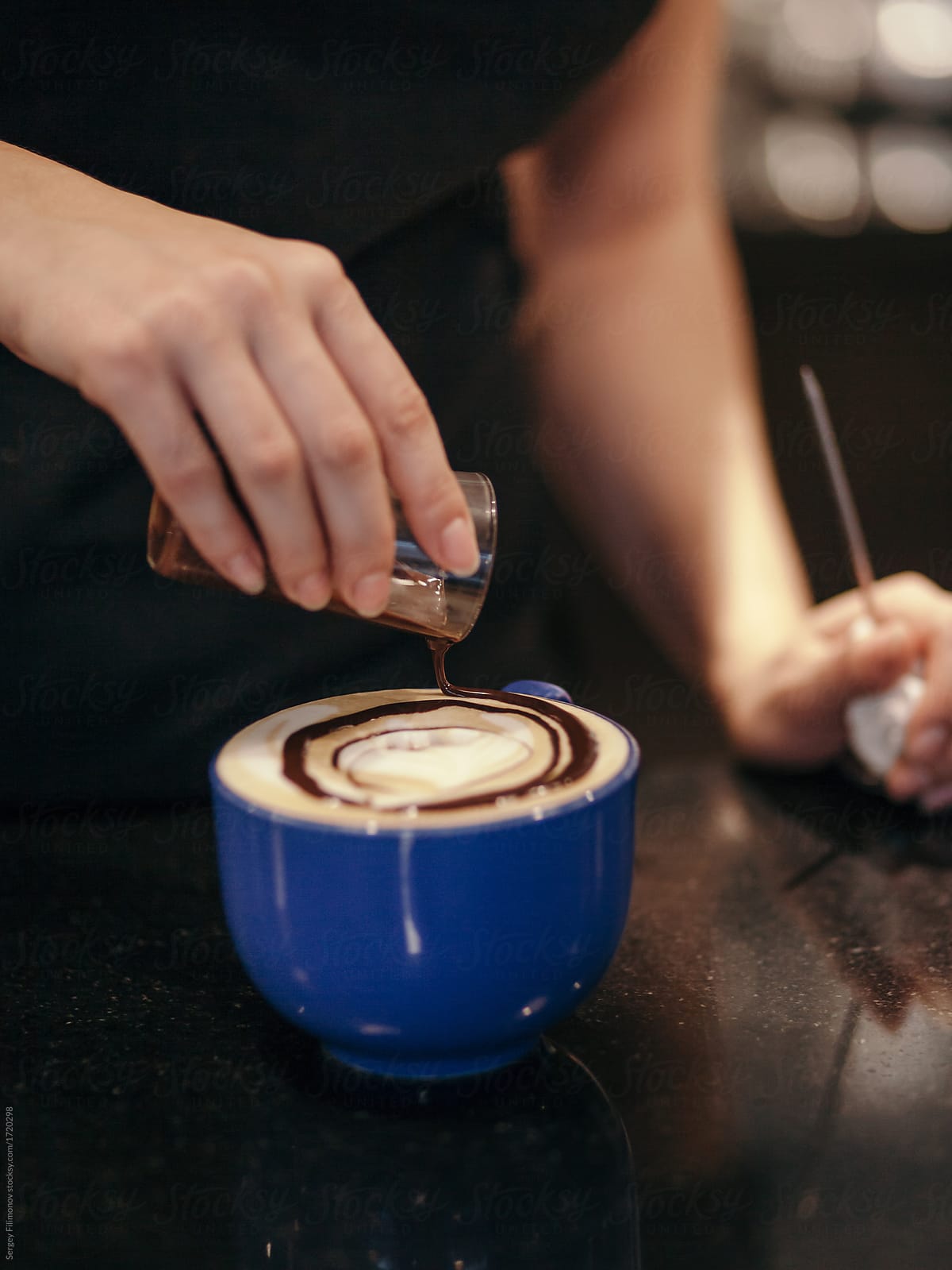 "Barista Pouring Syrup In Prepared Latte" by Stocksy Contributor "Serge ...