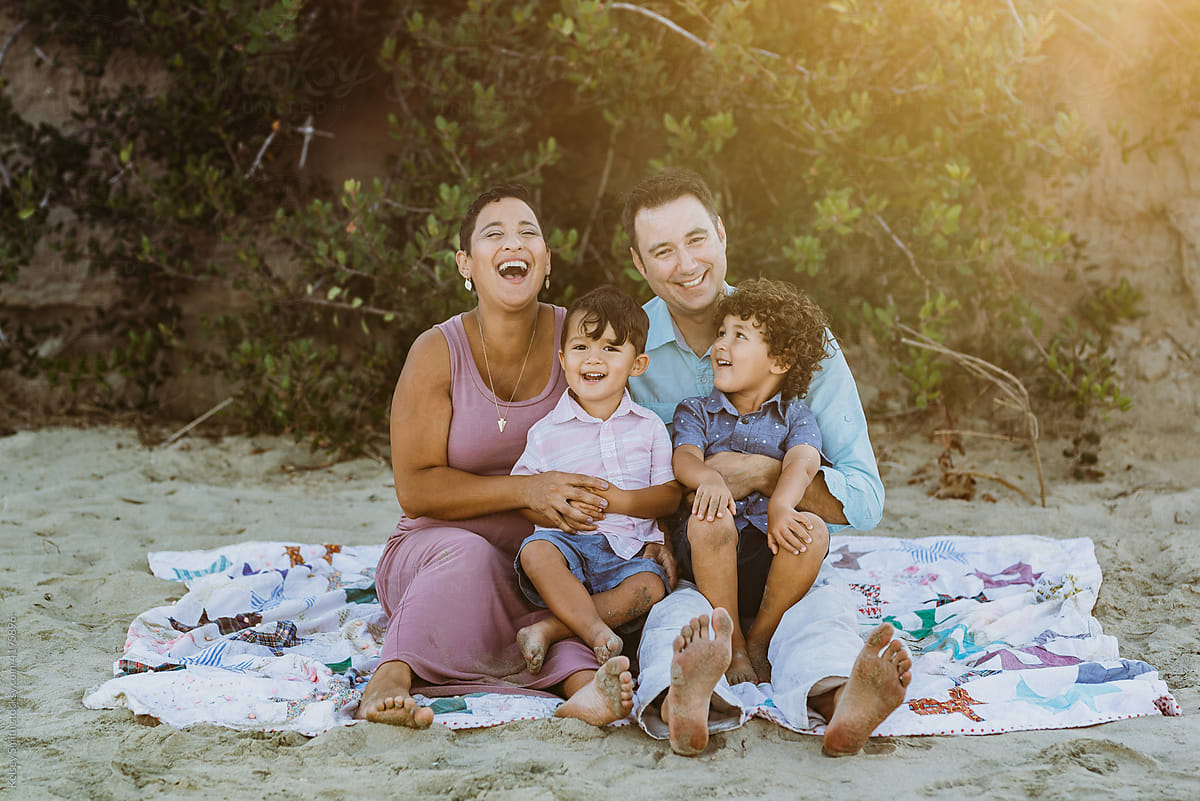 "Family Portrait Sitting On Beach" by Stocksy Contributor "Kelsey Smith ...